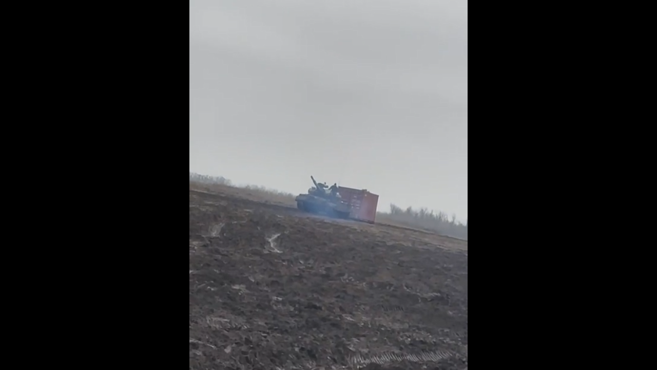 Tank Drags Container to Build Bunker